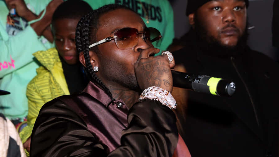 Pictured Here Is A Solemn Portrait Of Deceased Rappers Wallpaper ...